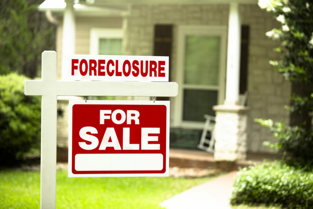 Who is responsible for HOA dues after foreclosure?